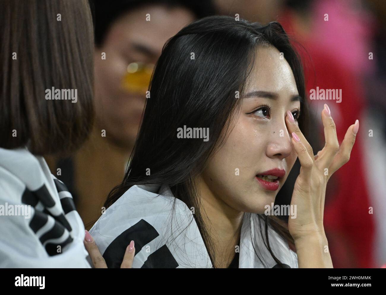 Al Rayyan, Qatar. 6th Feb, 2024. A fan of South Korea reacts after the ...