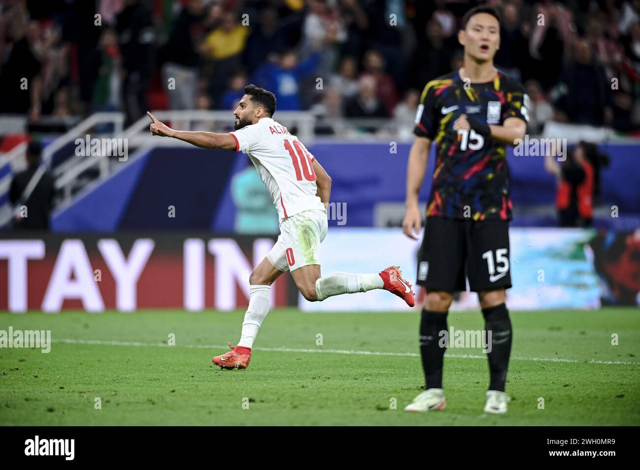 Al Rayyan, Qatar. 6th Feb, 2024. Jordan's Mousa Altamari (L) celebrates ...