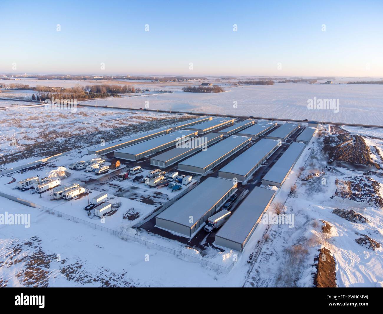 Drone view of a rental storage unit facility with closed bay doors ...