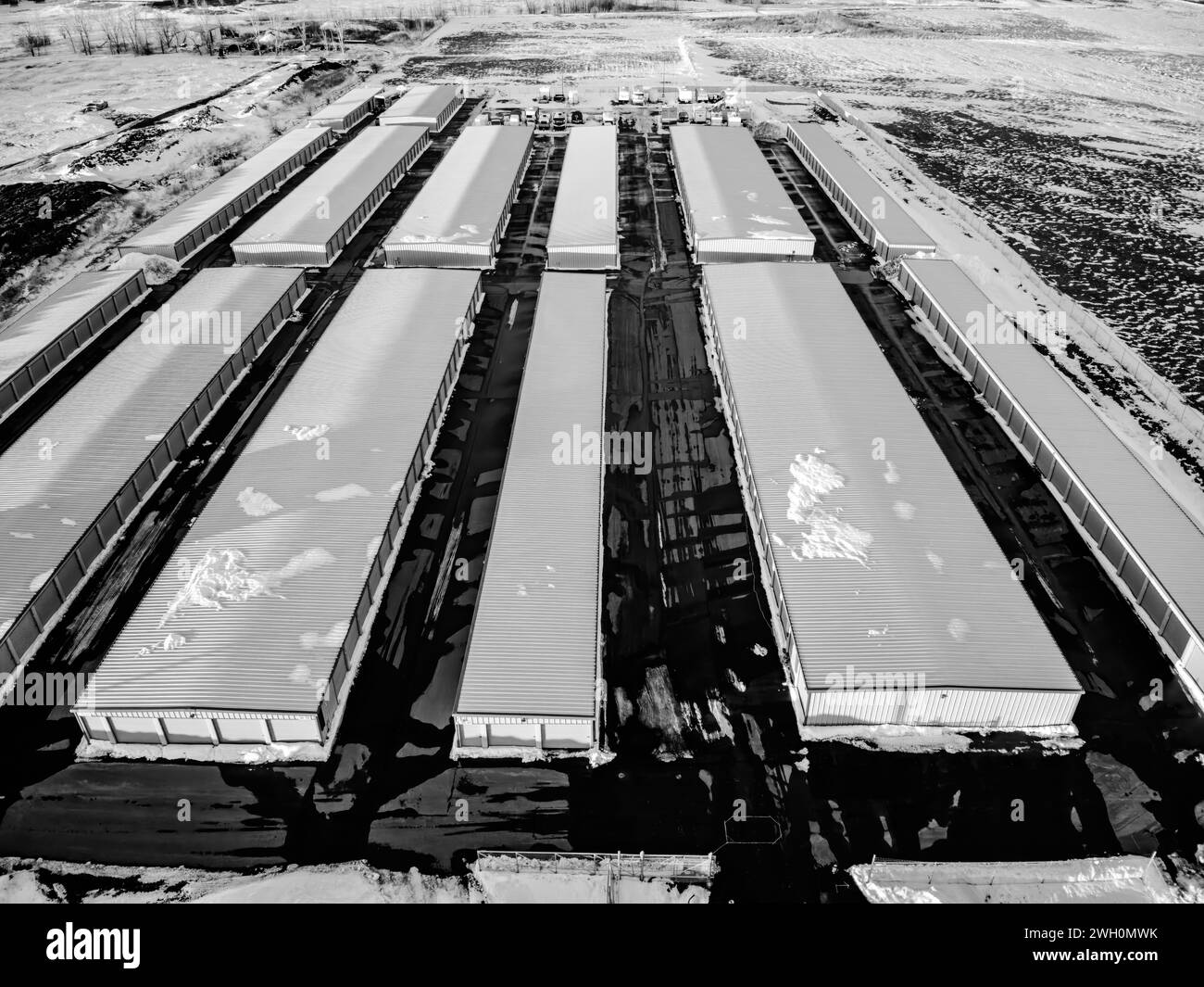 Drone view of a rental storage unit facility with closed bay doors ...