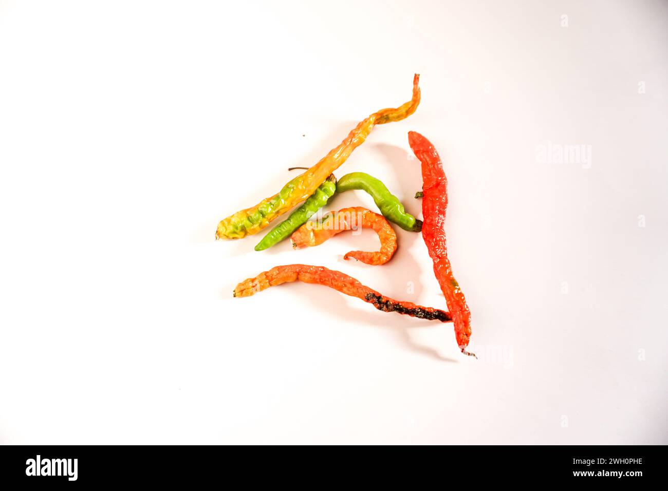 Dried and rotting chili peppers isolated on white background Stock ...