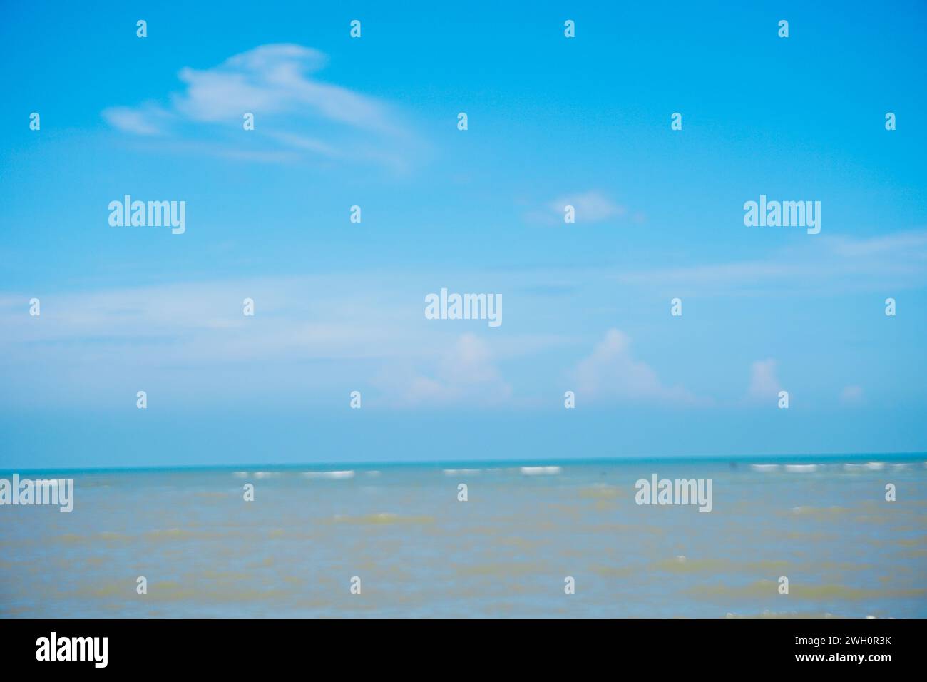 A minimalist and simple image that shows blue skies, trees with a ...