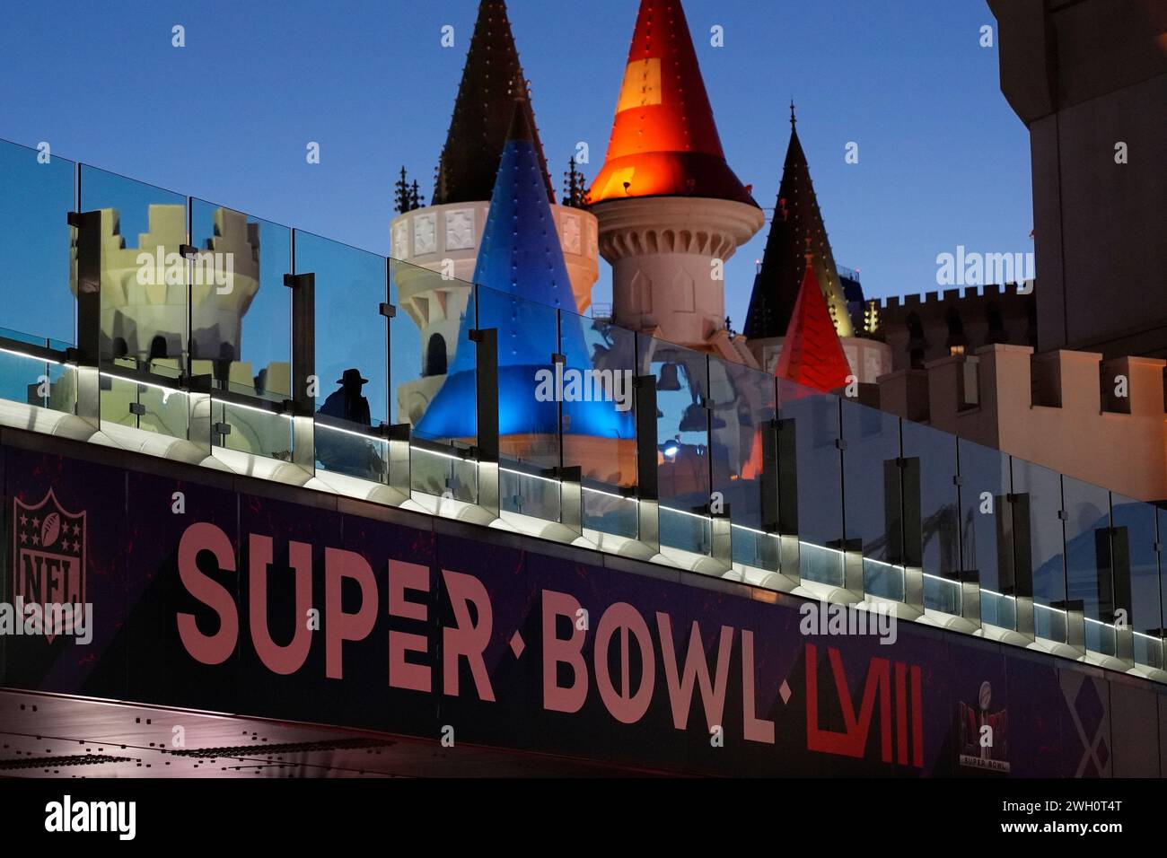 A sign for Super Bowl 58 adorns a pedestrian walkway across the Las ...