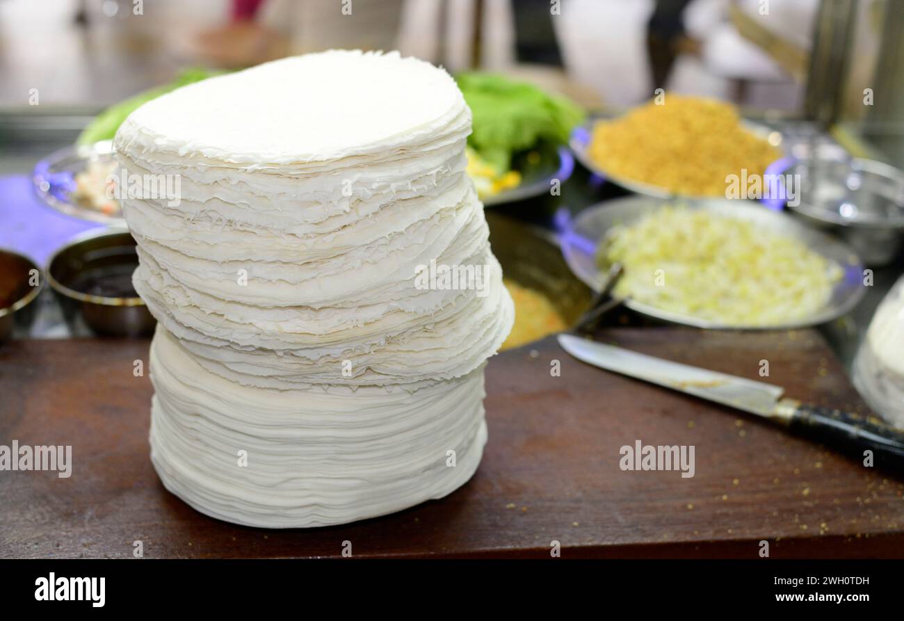 A pile of Popiah skin (thin paper-like crepe) at a Popiah restaruant in ...