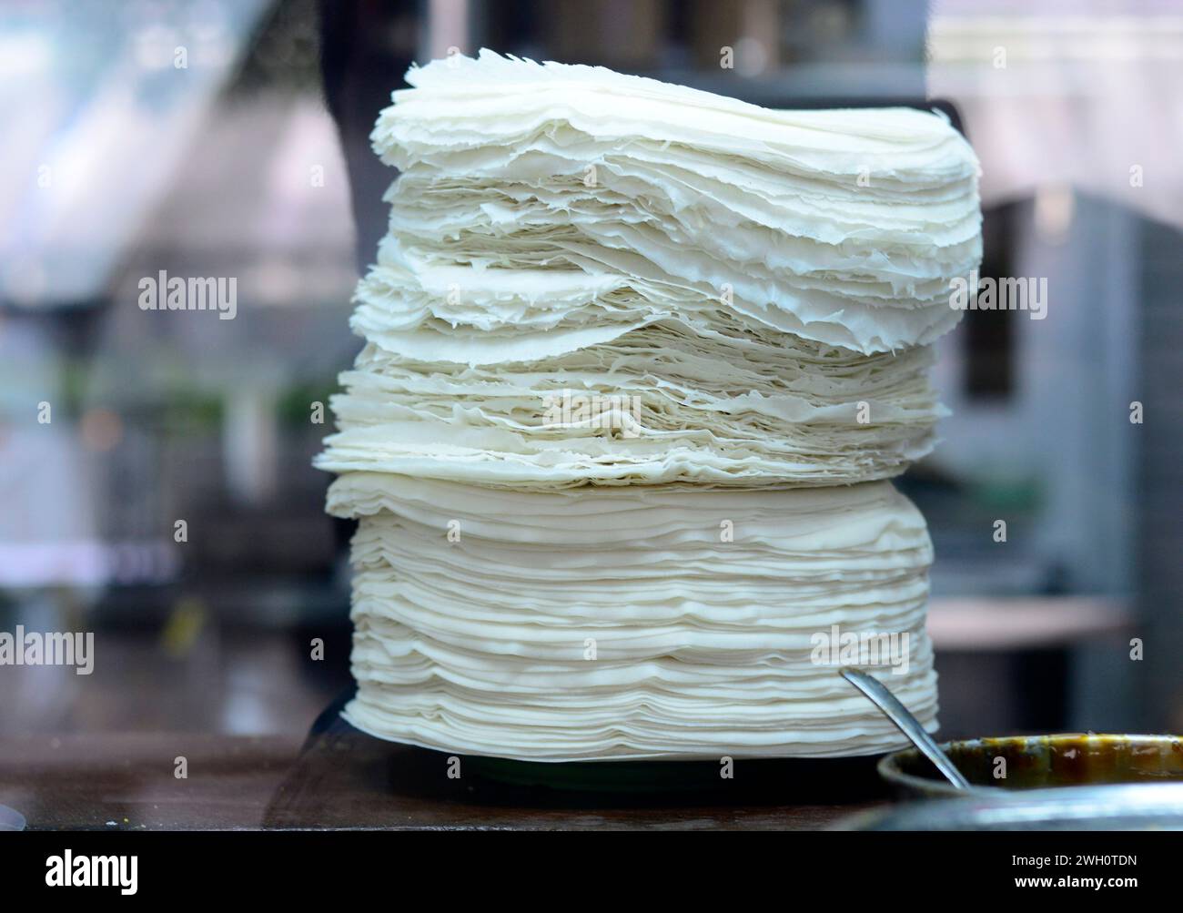 A pile of Popiah skin (thin paper-like crepe) at a Popiah restaruant in ...