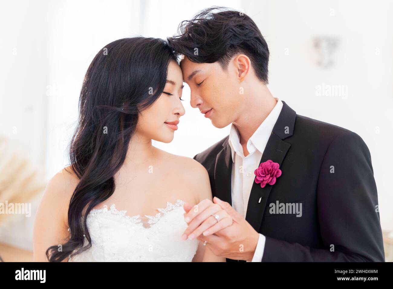 Bride and groom showcase their rings, a close-up view., symbolizing ...