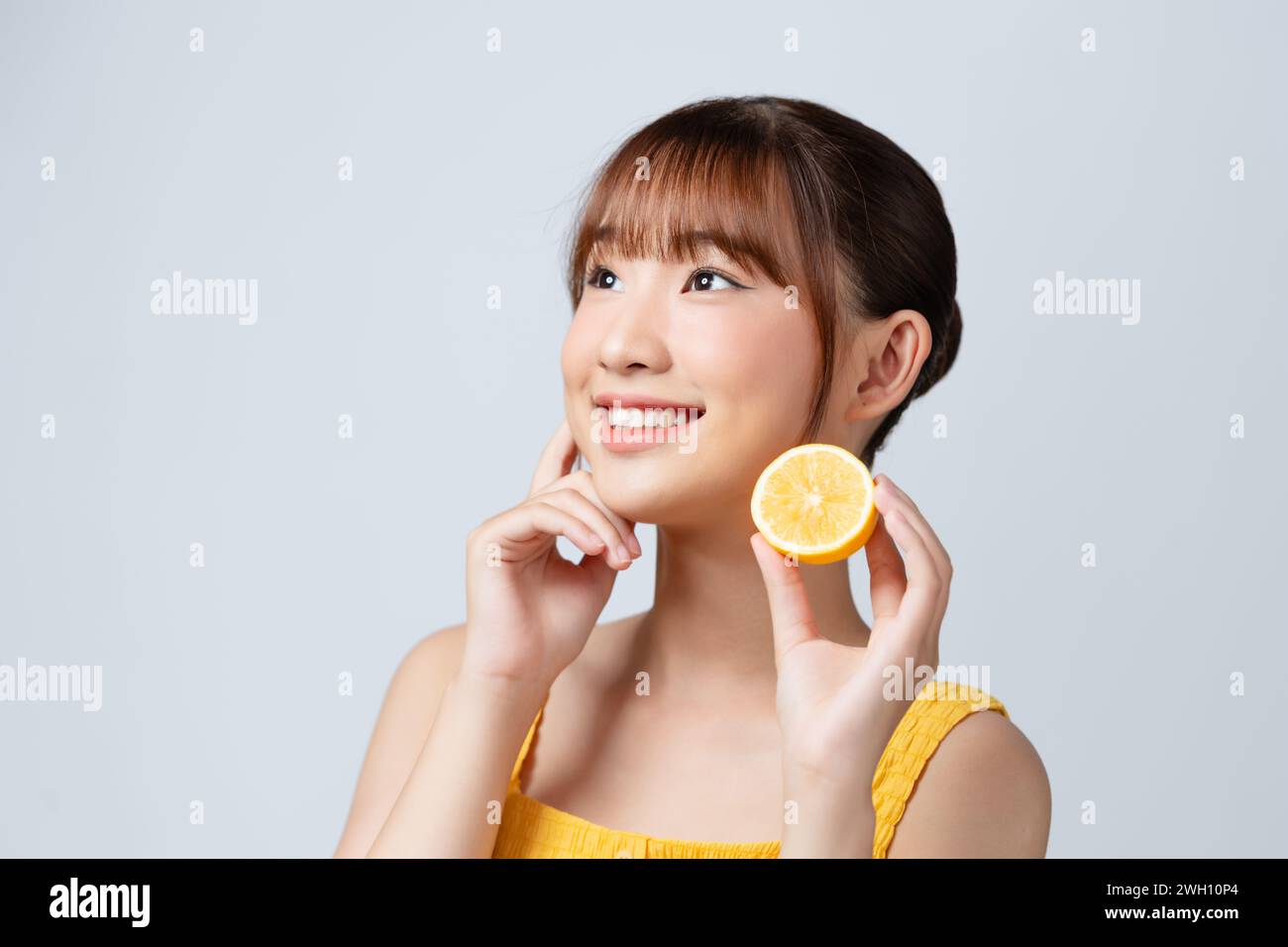 young beautiful girl with lemon isolated on white background Stock ...