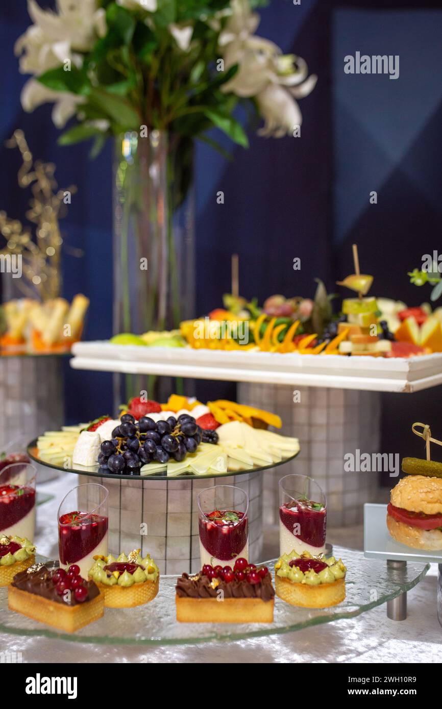 Catering banquet table with a variety of delicious appetizers and ...