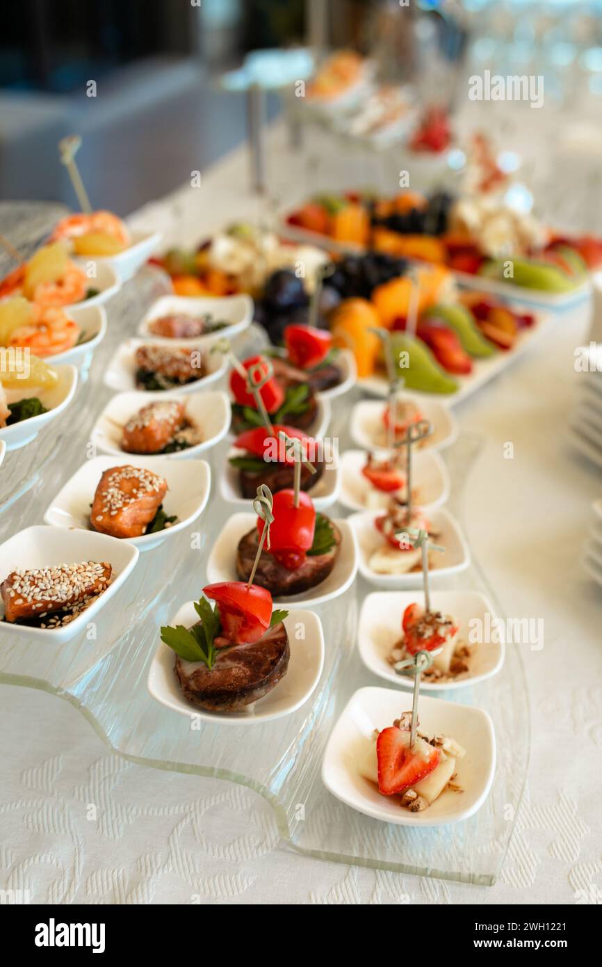 A diverse spread of appetizers and refreshing beverages awaits at this ...