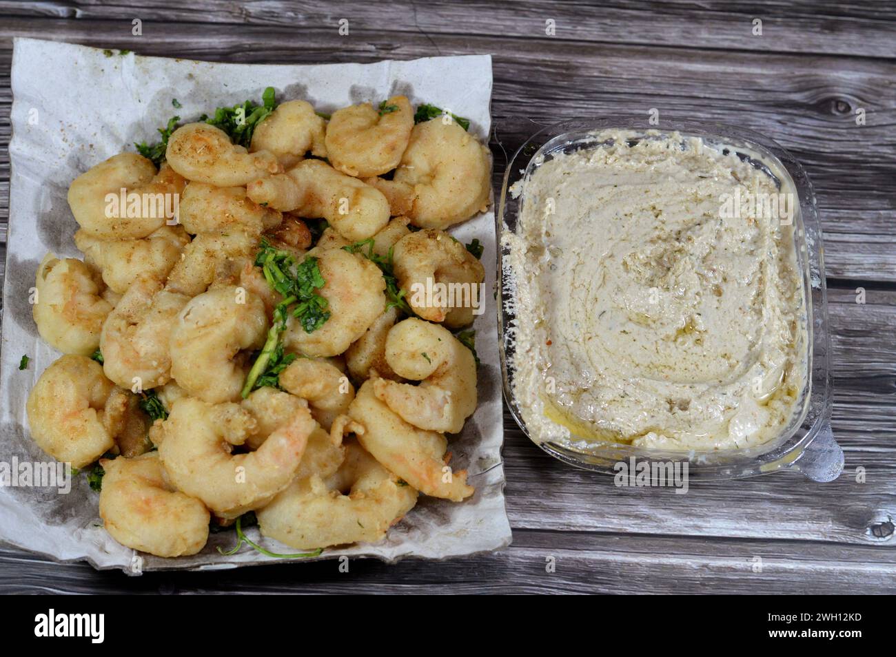 Tahini and Fried shrimps covered with flour and fried in deep hot oil ...