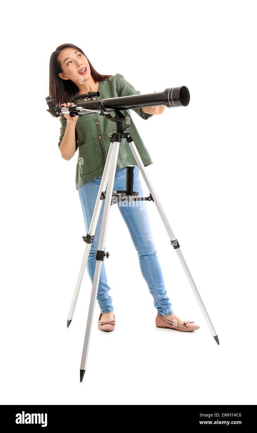 Young Asian woman using telescope on white background Stock Photo - Alamy