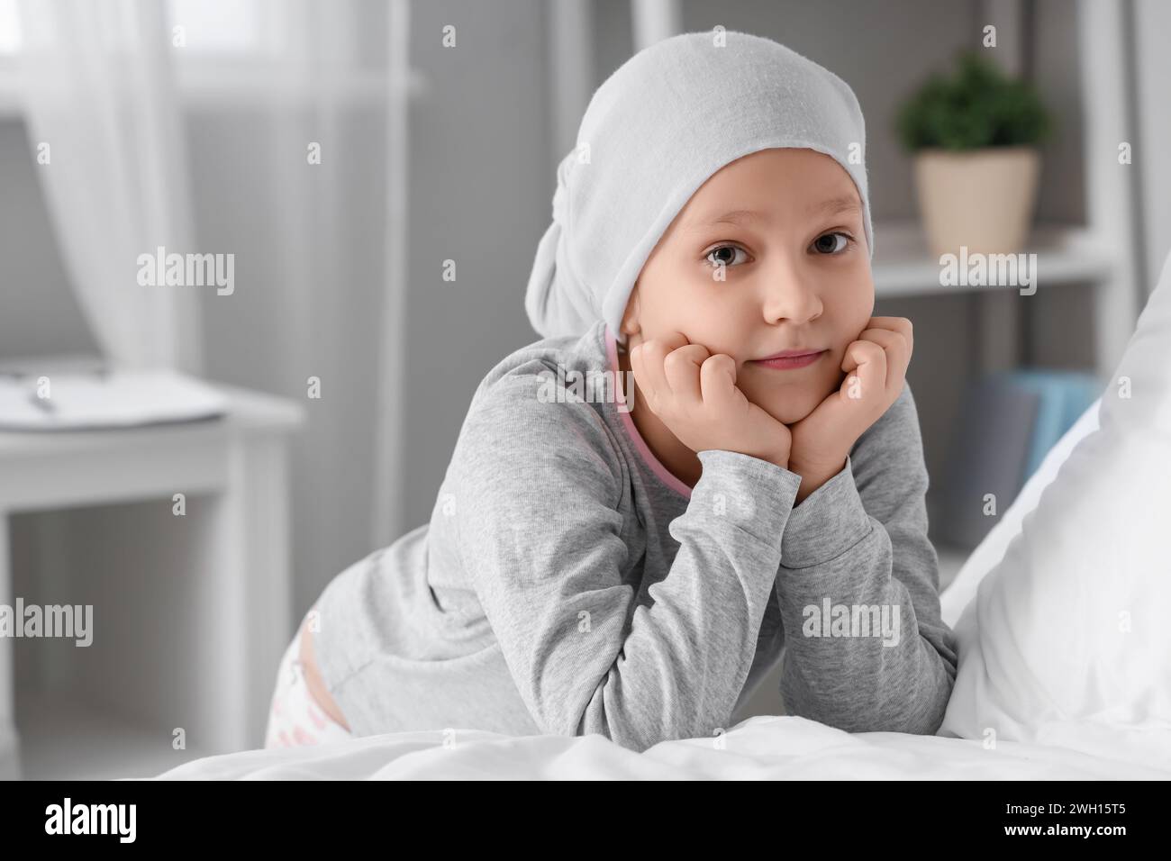 Little girl after chemotherapy in clinic. International Childhood ...