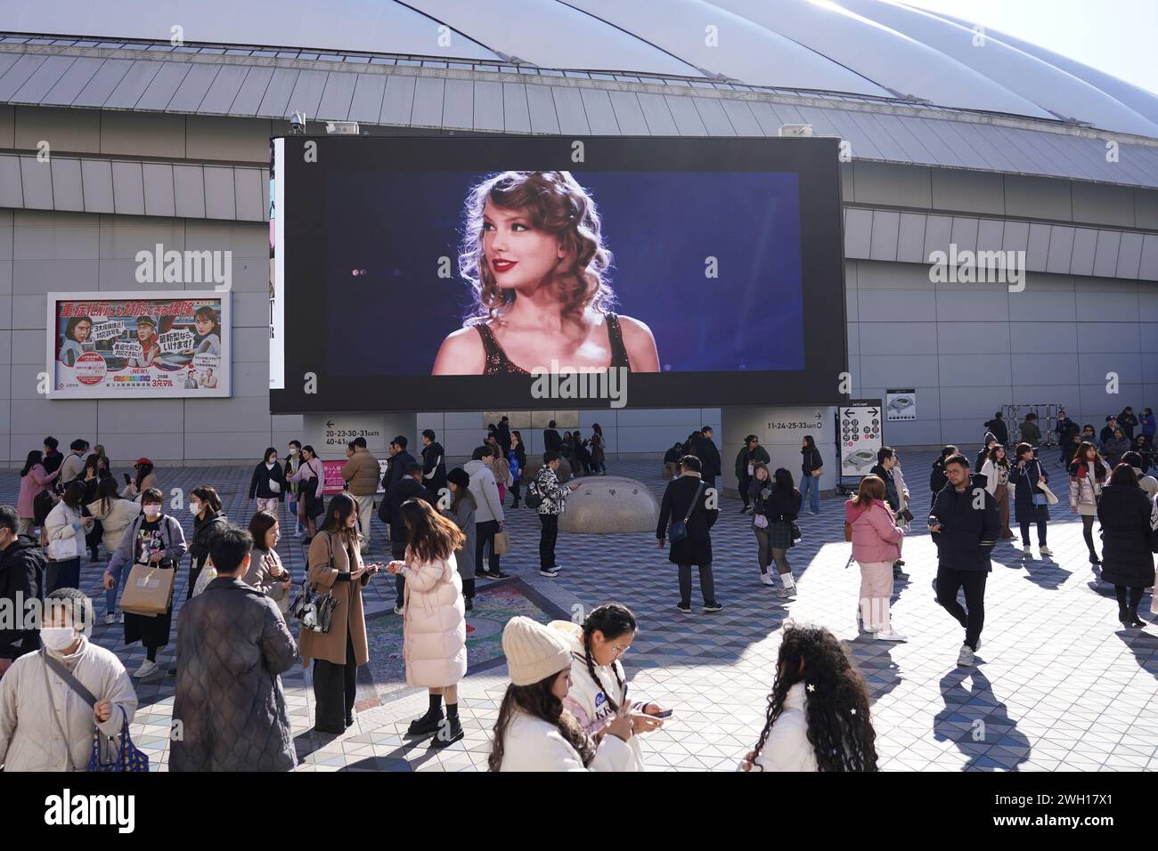 Fans arrive at the Tokyo Dome, for the Taylor Swift concert, as part of ...