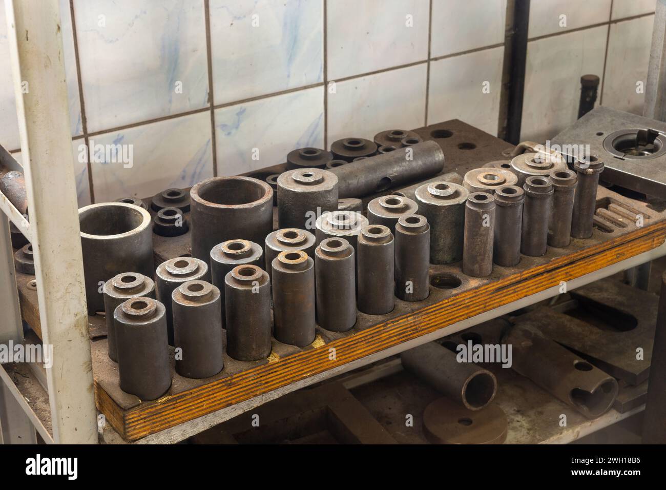 Set of different instruments on shelves in big workshop. A set of tools ...