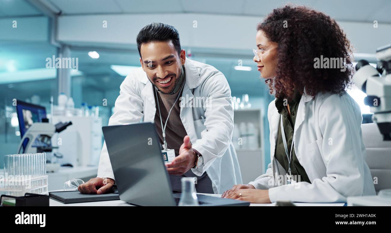 Scientist, teamwork and happy with laptop in laboratory for test ...