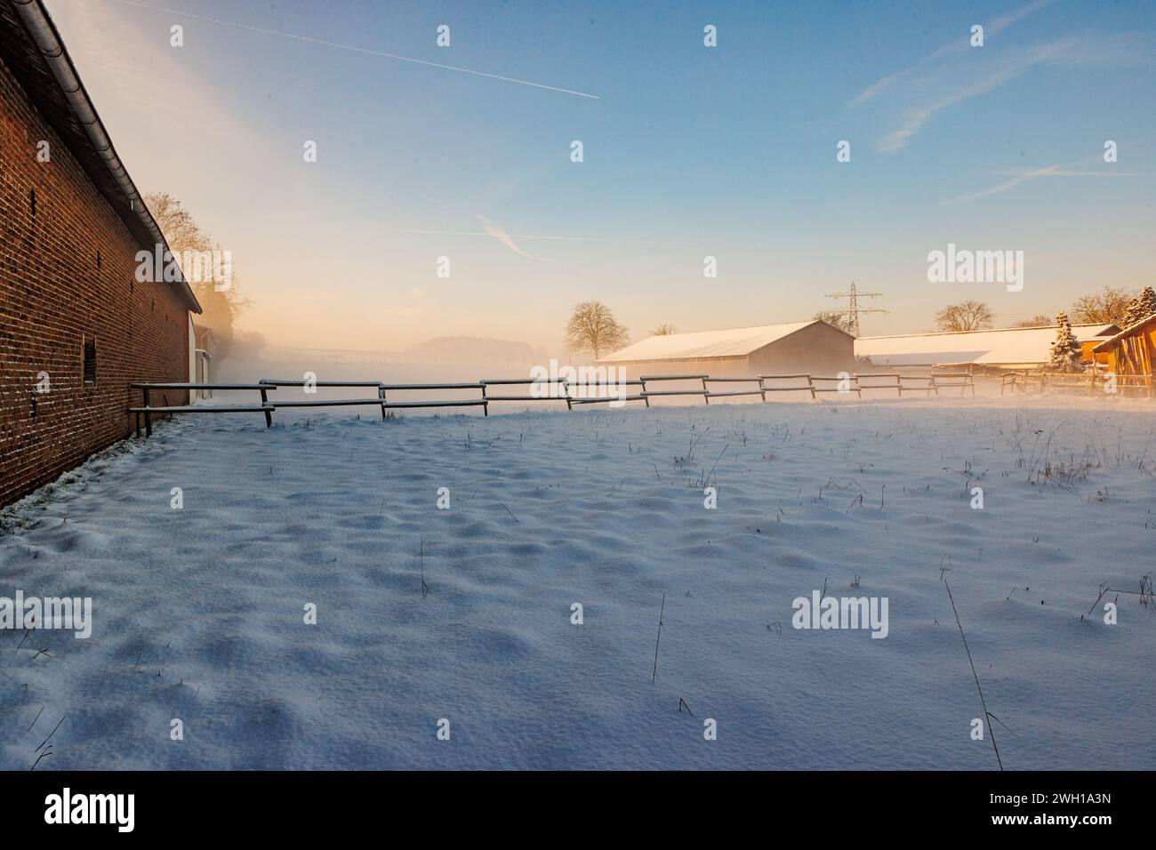 Agricultural plot covered in thick layer of snow after a heavy snowfall ...