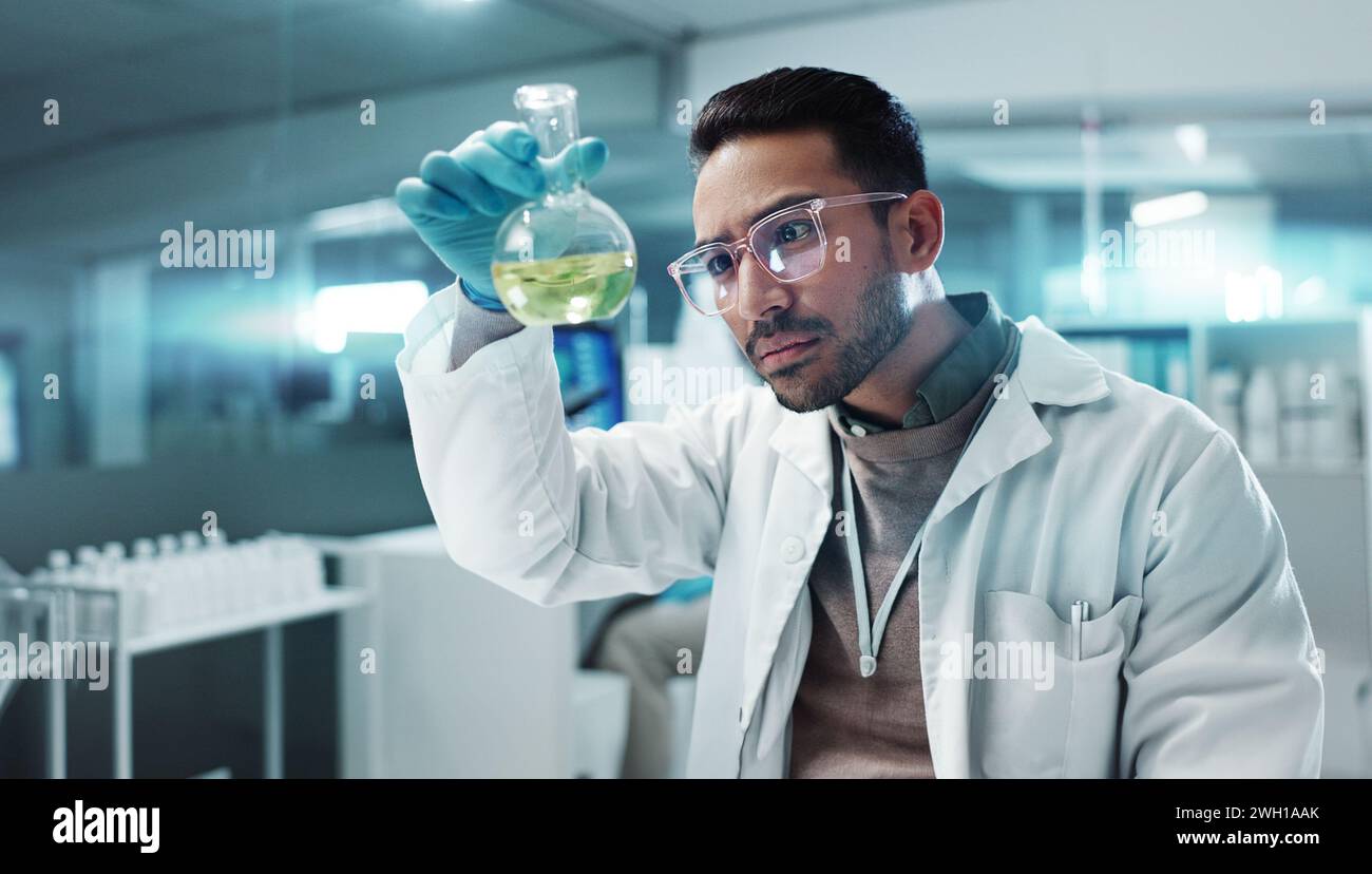 Scientist, man and chemical with laptop in laboratory for chemistry ...