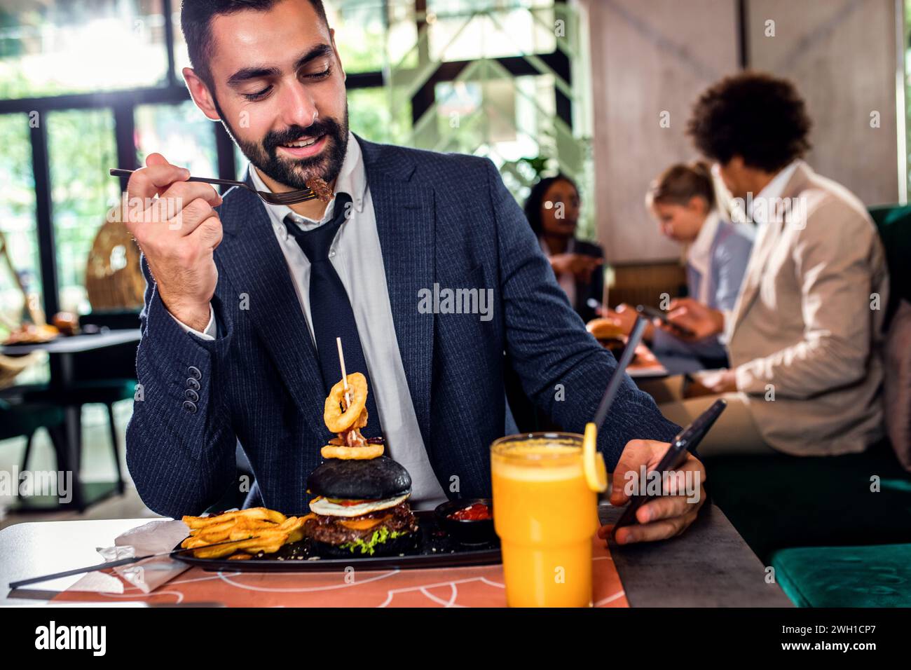 Businessman having lunch hi-res stock photography and images - Alamy