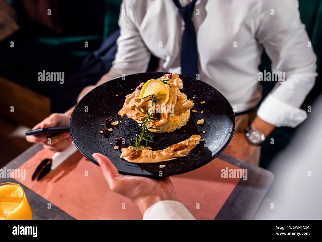 Restaurant employee sitting table hi-res stock photography and images ...