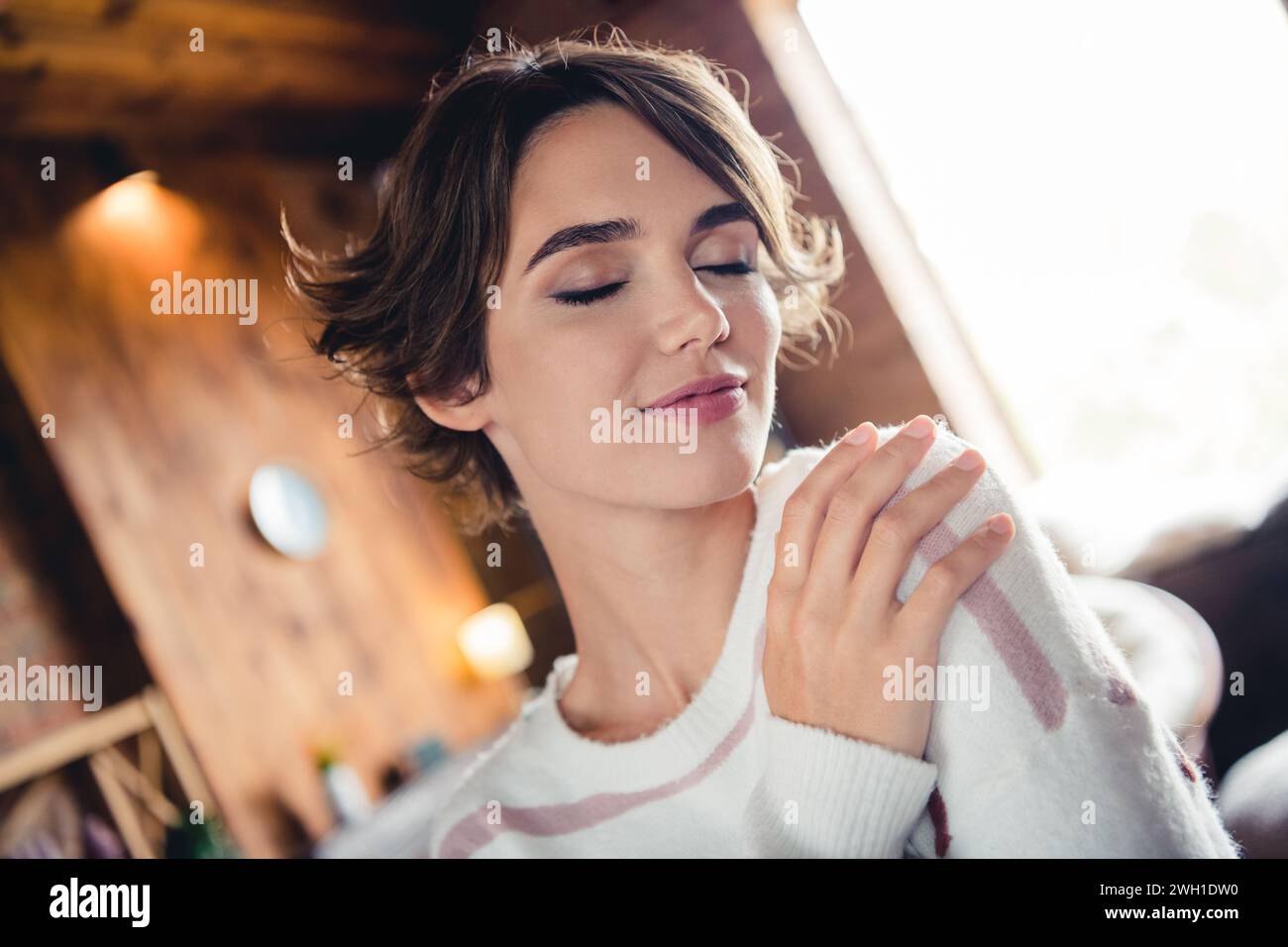 Photo of pretty satisfied girl closed eyes arm embrace touch shoulder ...
