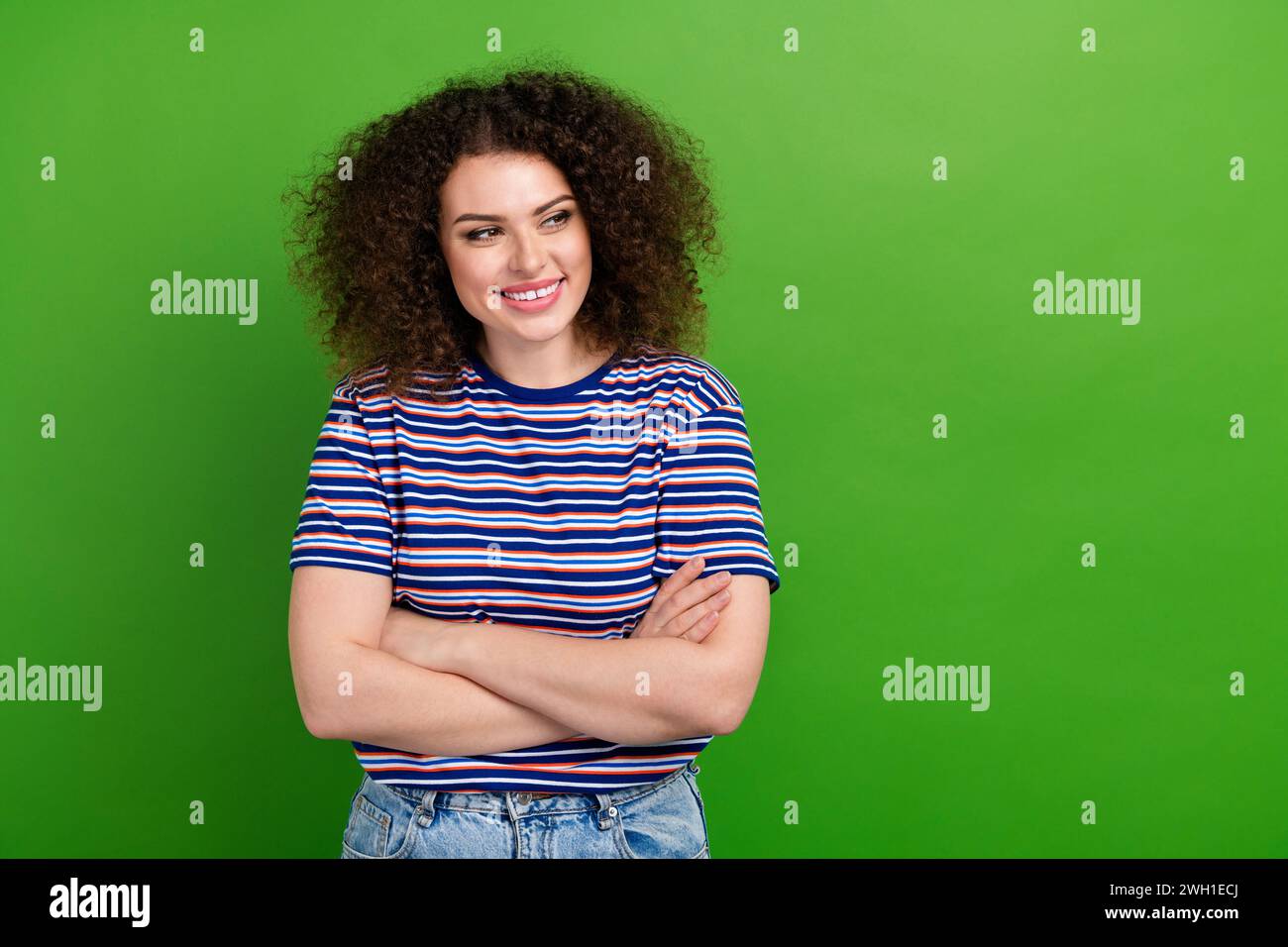 Portrait of intelligent minded person folded arms look empty space ...