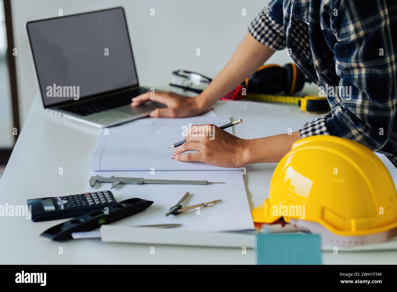 architect man working with laptop and blueprints,engineer inspection in ...