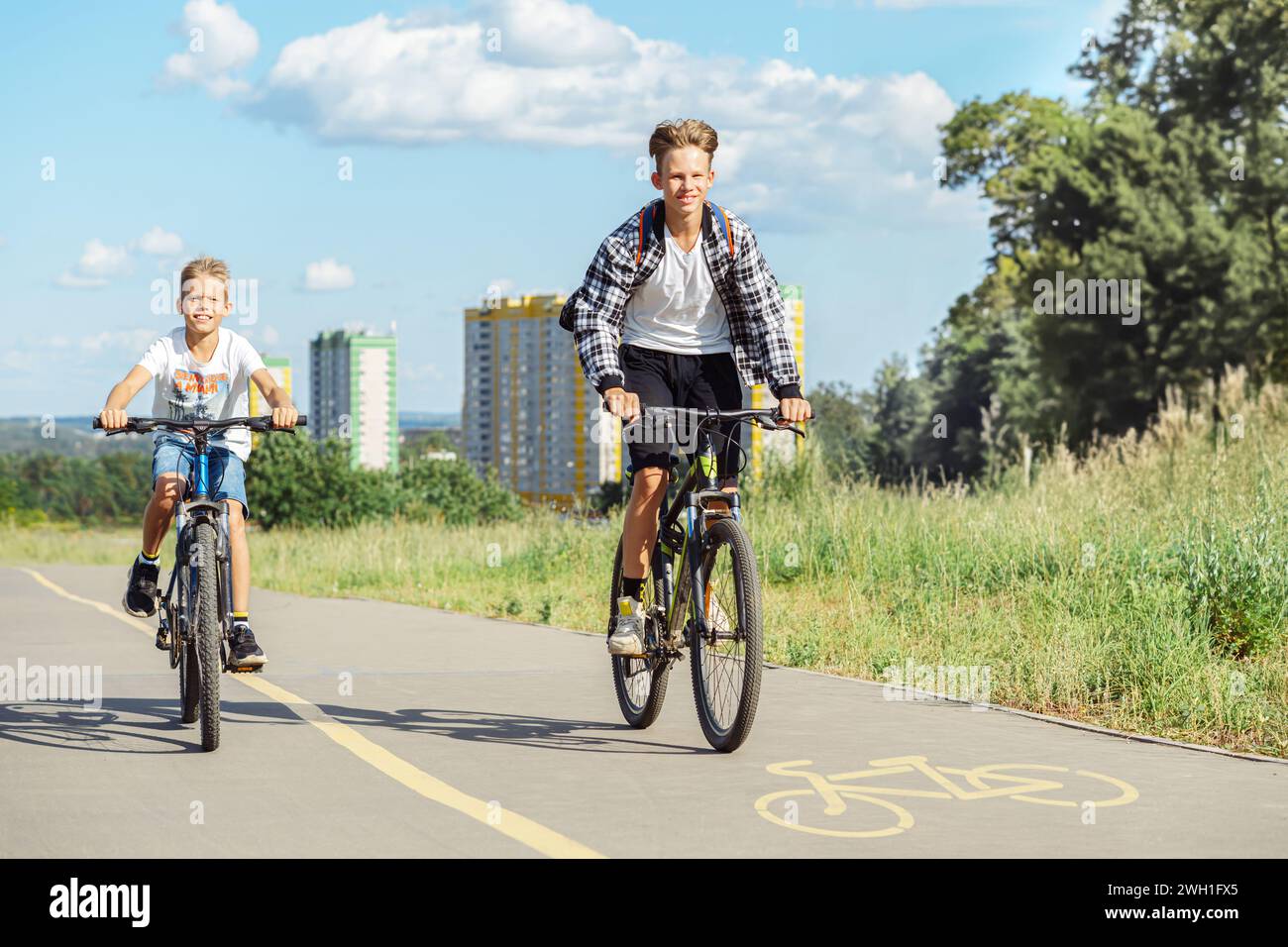 Boys ride bikes hi-res stock photography and images - Alamy