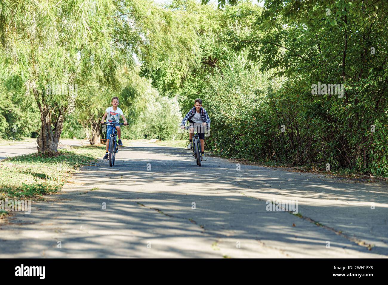 Two boys on bicycles hi-res stock photography and images - Alamy