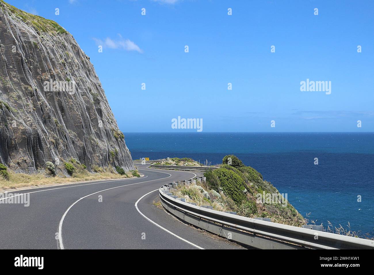The great ocean road with slope rockfall protection mesh and beautiful ...