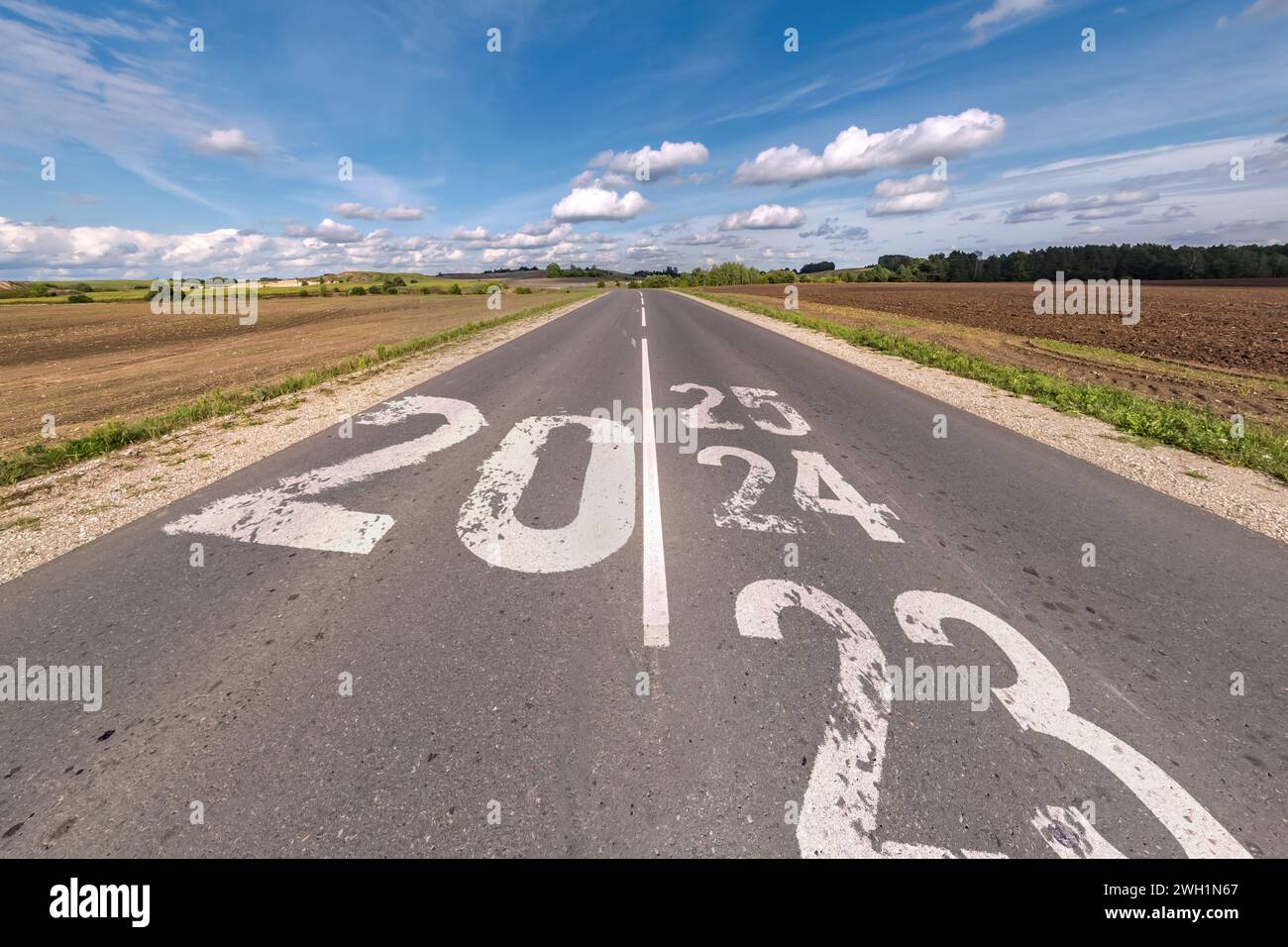 sign 2023, 2024 and start on asphalt road highway with sunrise or ...