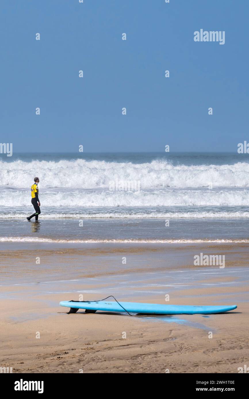 Surfer standing in the sea hi-res stock photography and images - Alamy