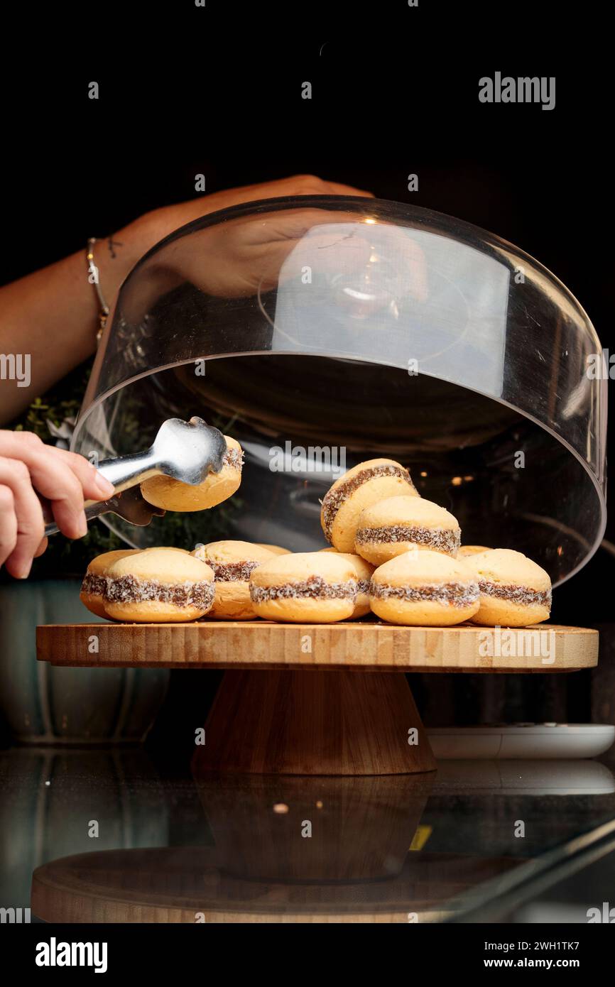 A delicious assortment of baked goods showcased in a display case, bar ...