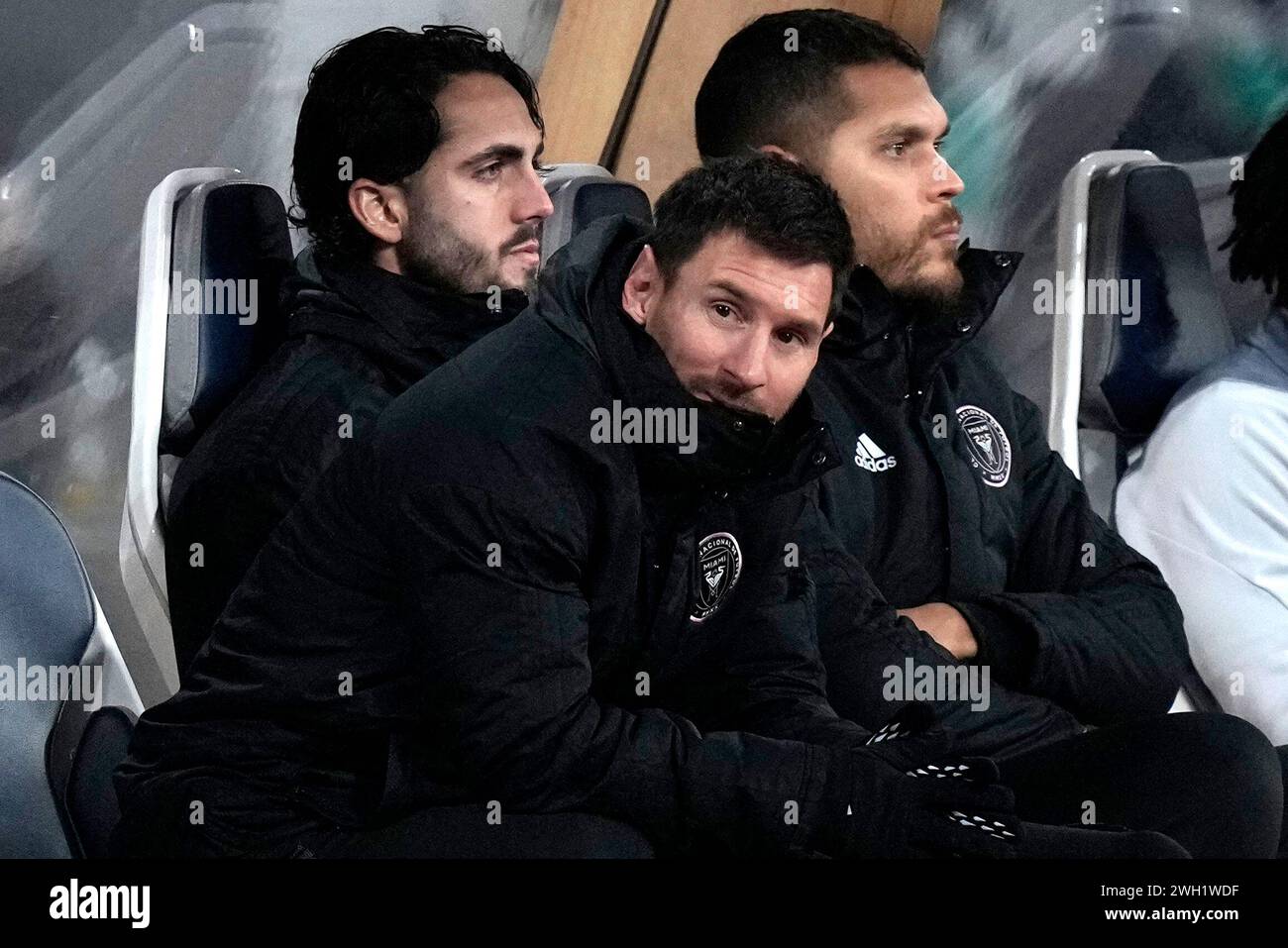 Inter Miami's Lionel Messi, center, sits on the bench during the ...