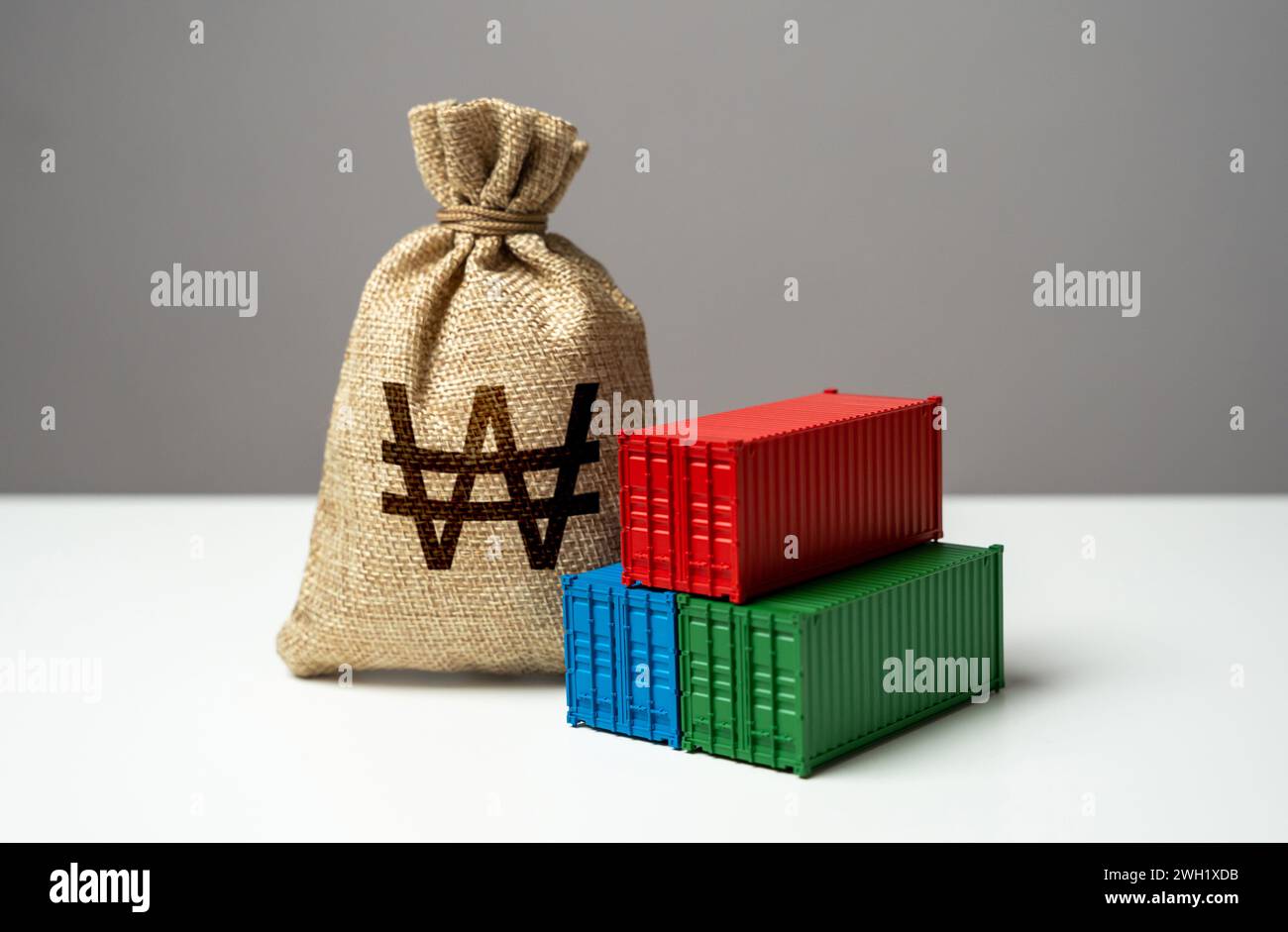 Stack of shipping containers and south korean won money bag. Trade ...