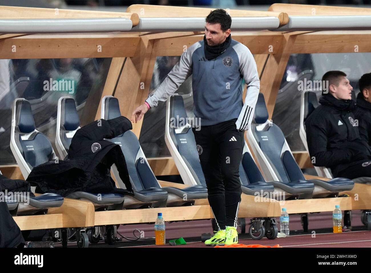 Inter Miami's Lionel Messi takes his jacket off for a warm up during ...