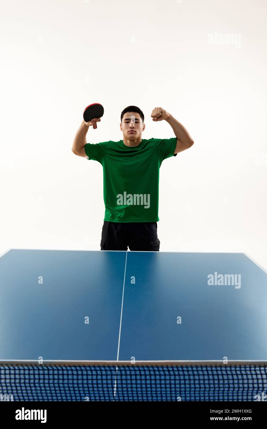 Exultant Asian man, table tennis champion demonstrated muscles in the ...