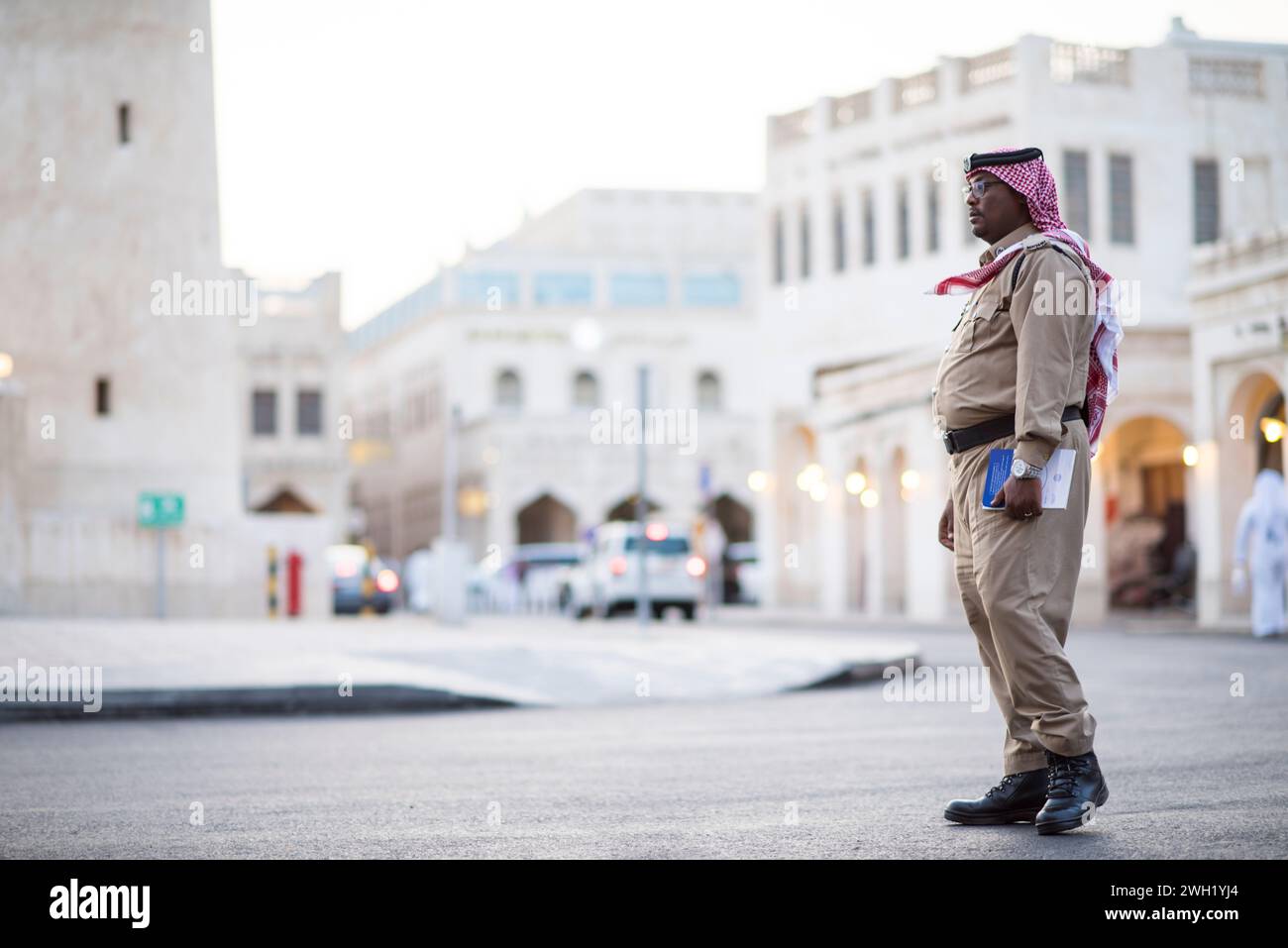 Doha, Qatar-December 16,2023 : Police in traditional dress on front of ...