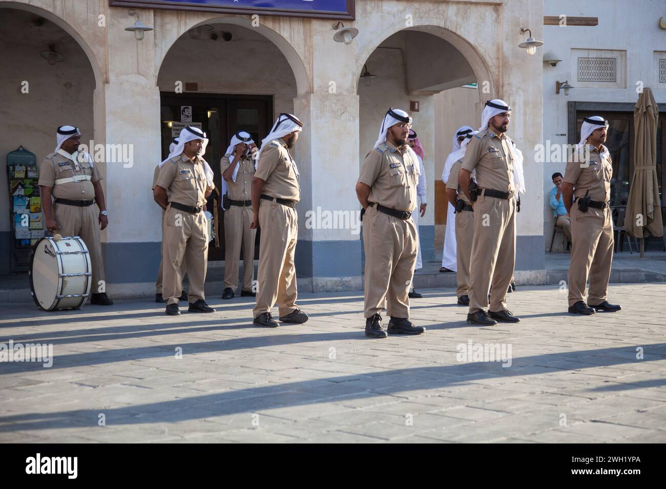 Doha, Qatar-December 16,2023 : Police in traditional dress on front of ...