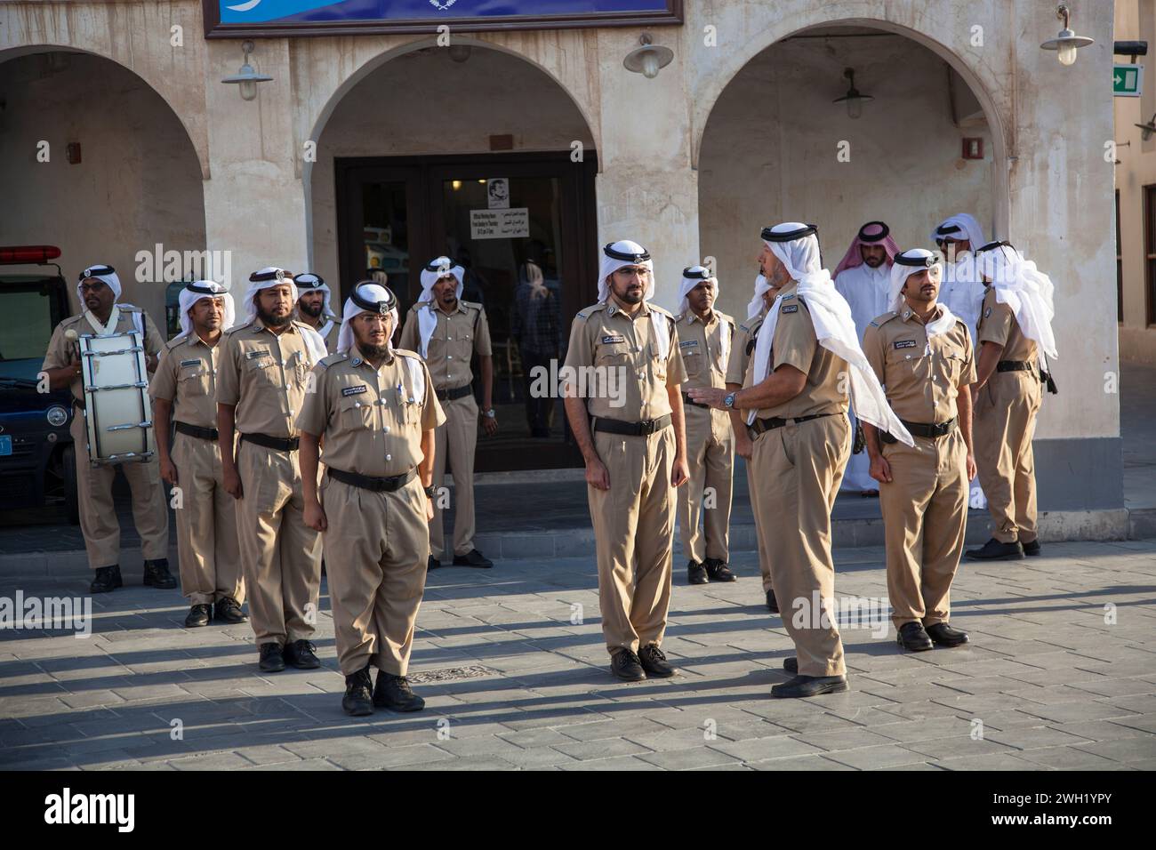 Doha, Qatar-December 16,2023 : Police in traditional dress on front of ...
