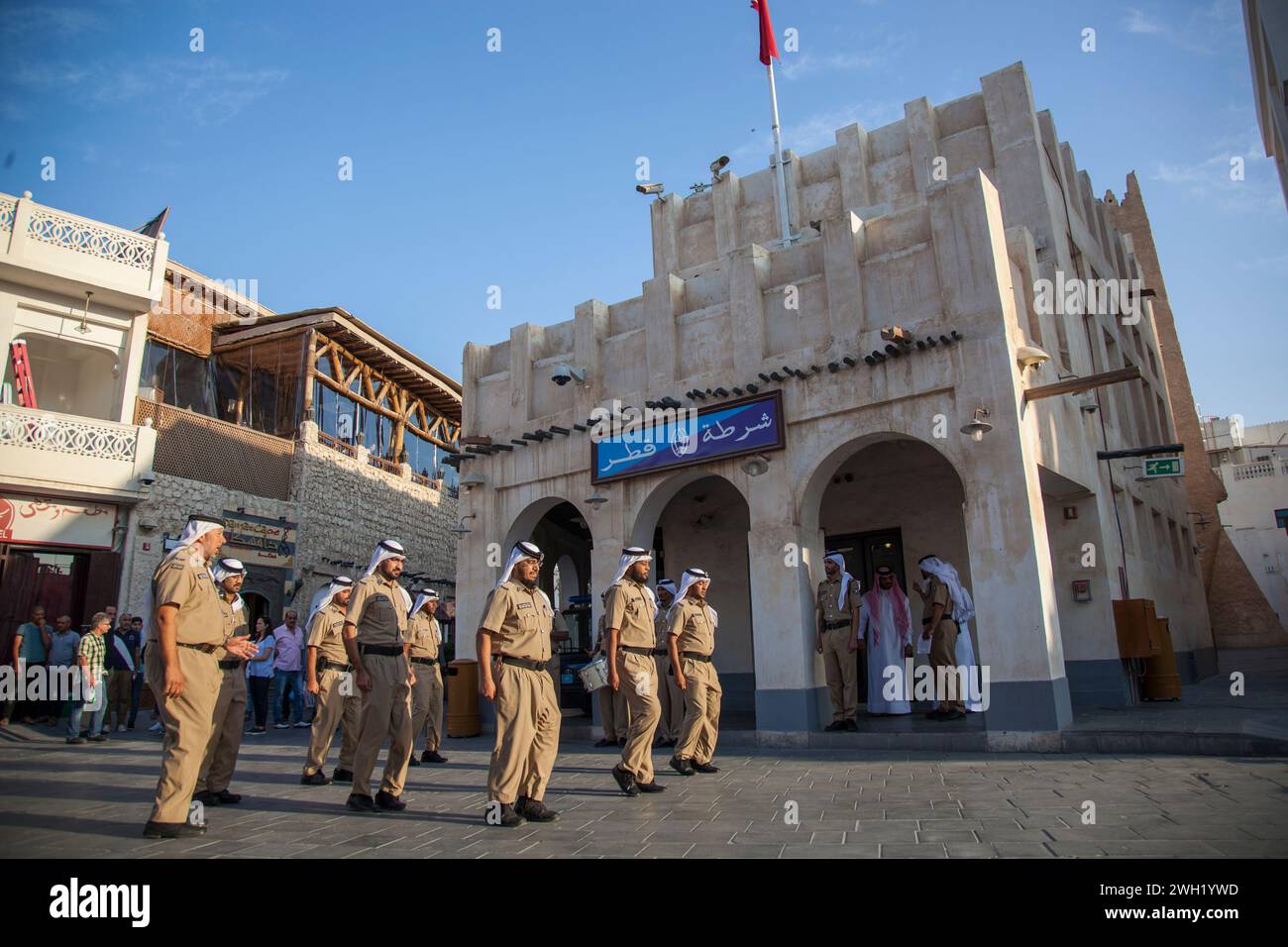 Doha, Qatar-December 16,2023 : Police in traditional dress on front of ...