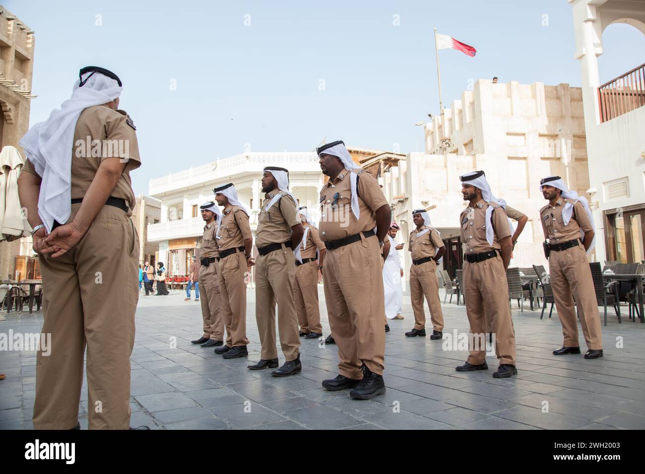 Doha, Qatar-December 16,2023 : Police in traditional dress on front of ...
