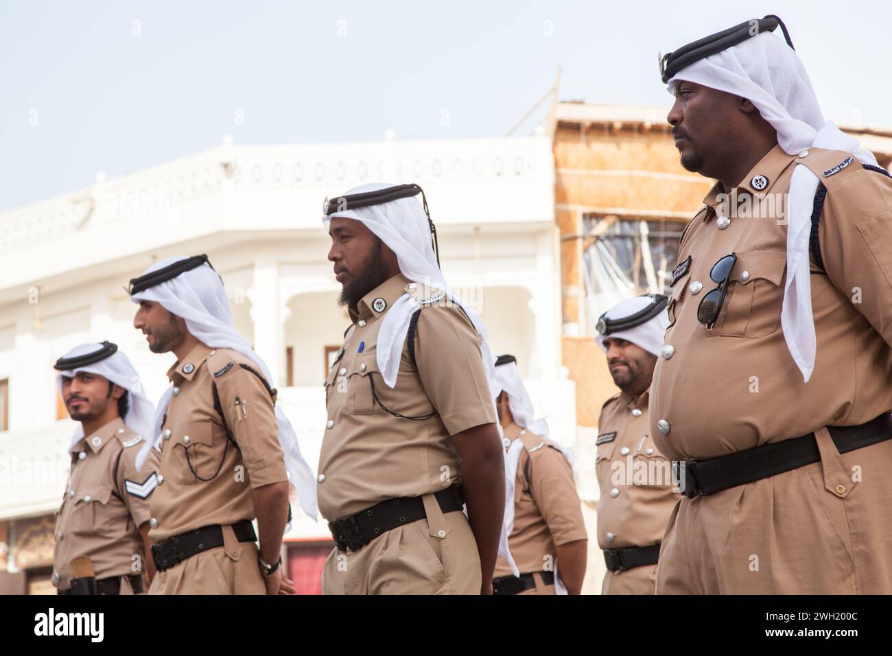 Doha, Qatar-December 16,2023 : Police in traditional dress on front of ...