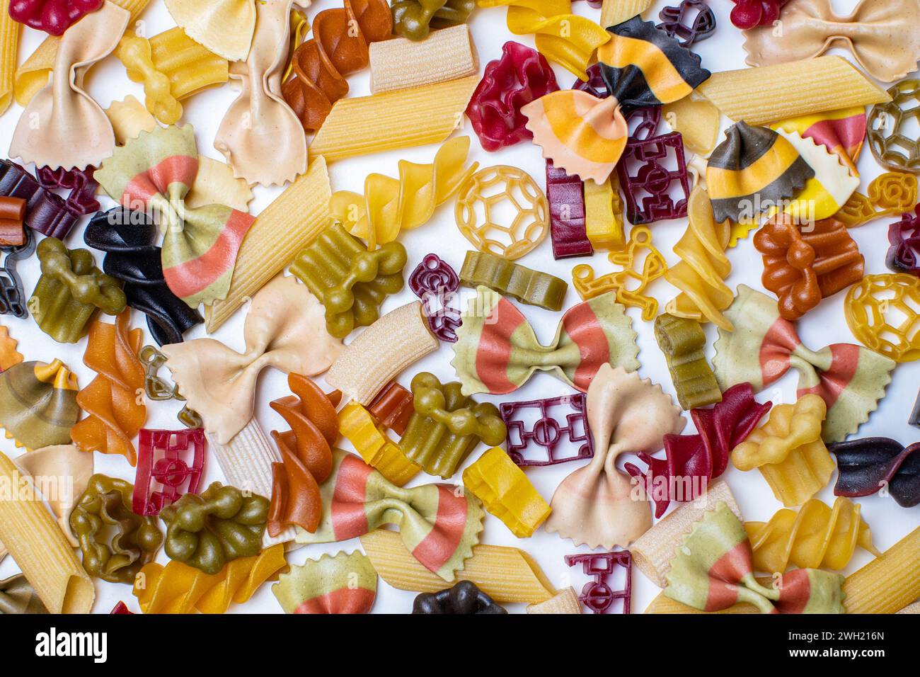 various types of pasta on white surface Stock Photo - Alamy