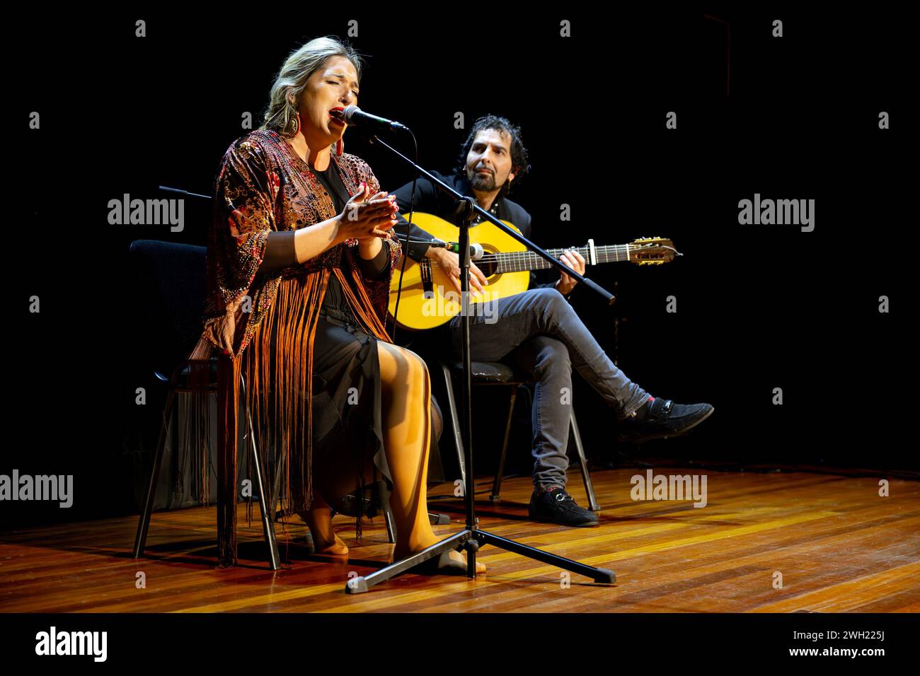 "A female flamenco singer and male guitarist captivate the audience ...
