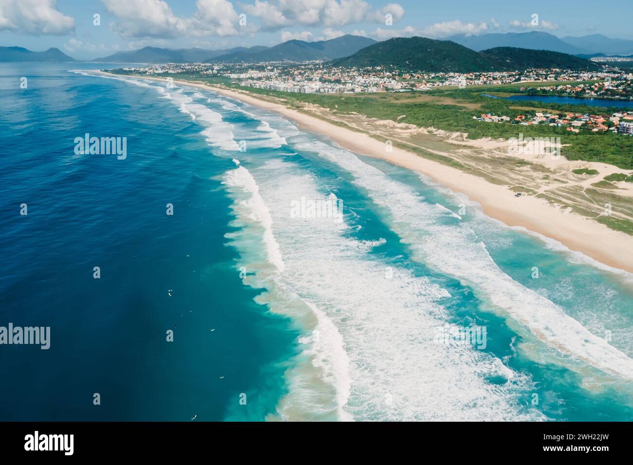 Scenic beach and ocean with surfing waves in Brazil. Aerial view of ...