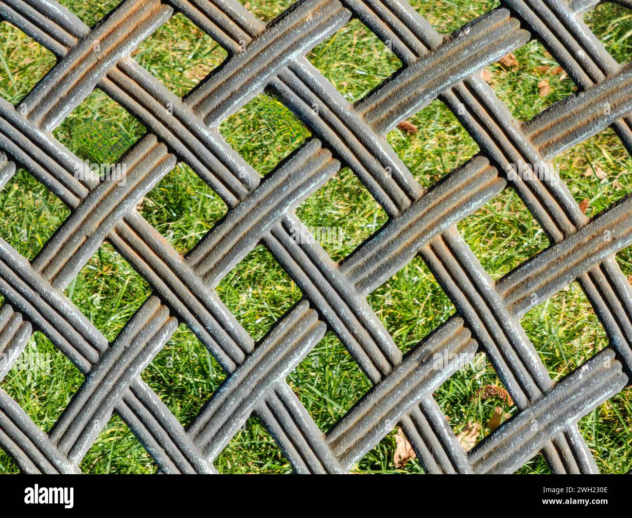 Partial back support of the park bench. Pattern and texture. Grid lines ...