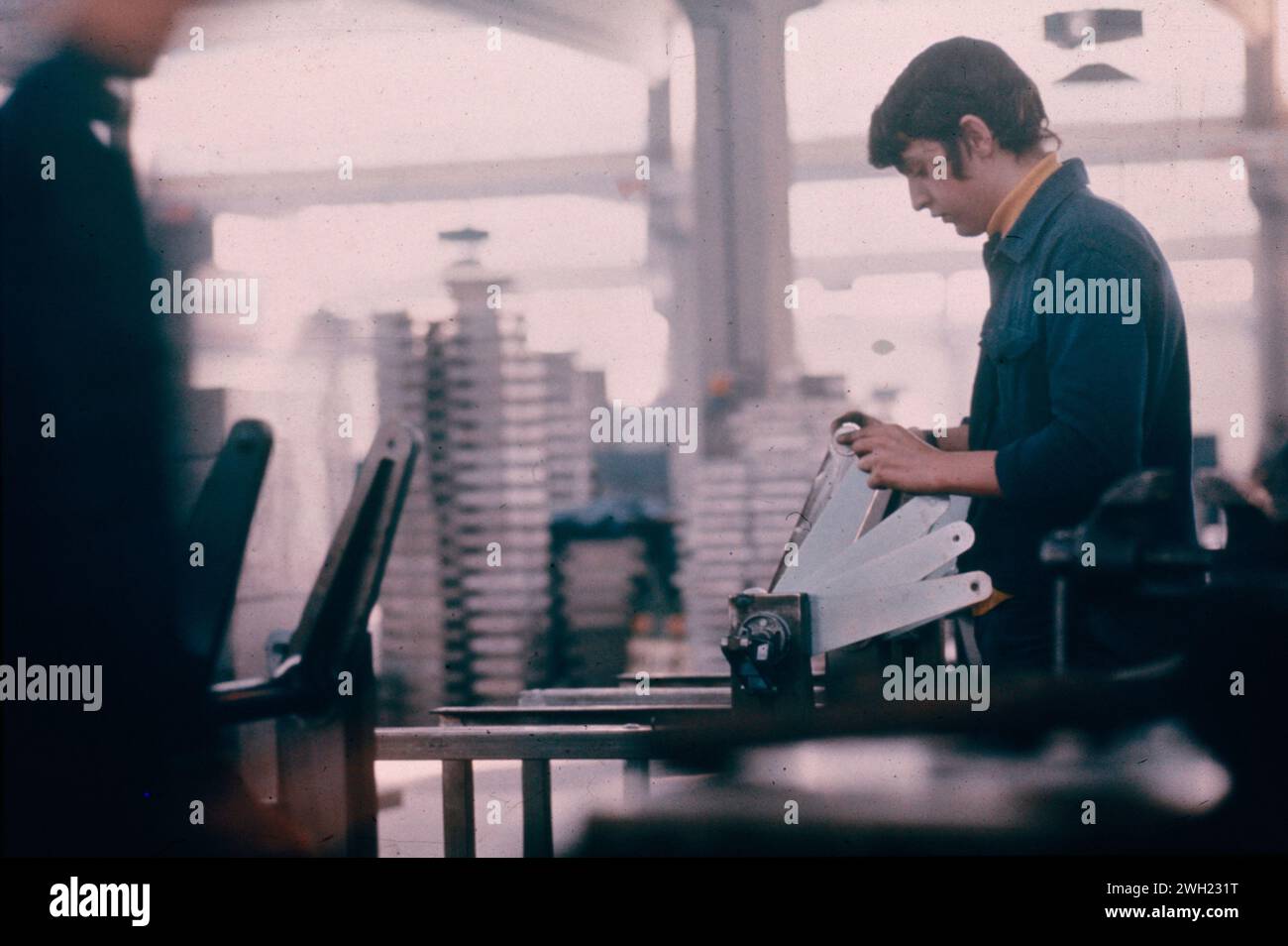 Handyman working at Bieffe design steel furniture factory, Caselle ...