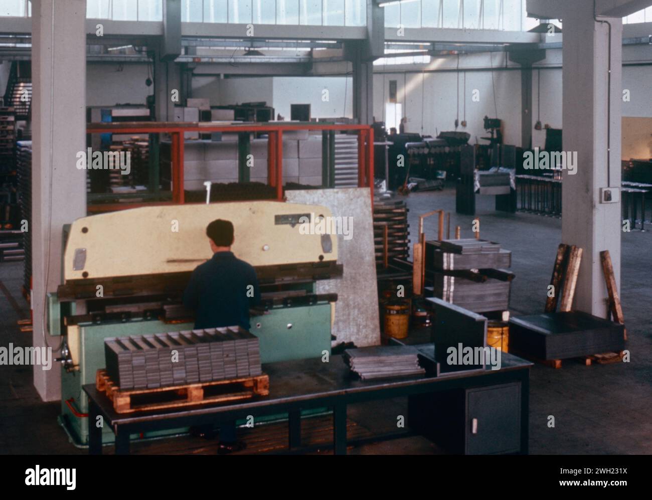 Handyman working at Bieffe design steel furniture factory, Caselle ...