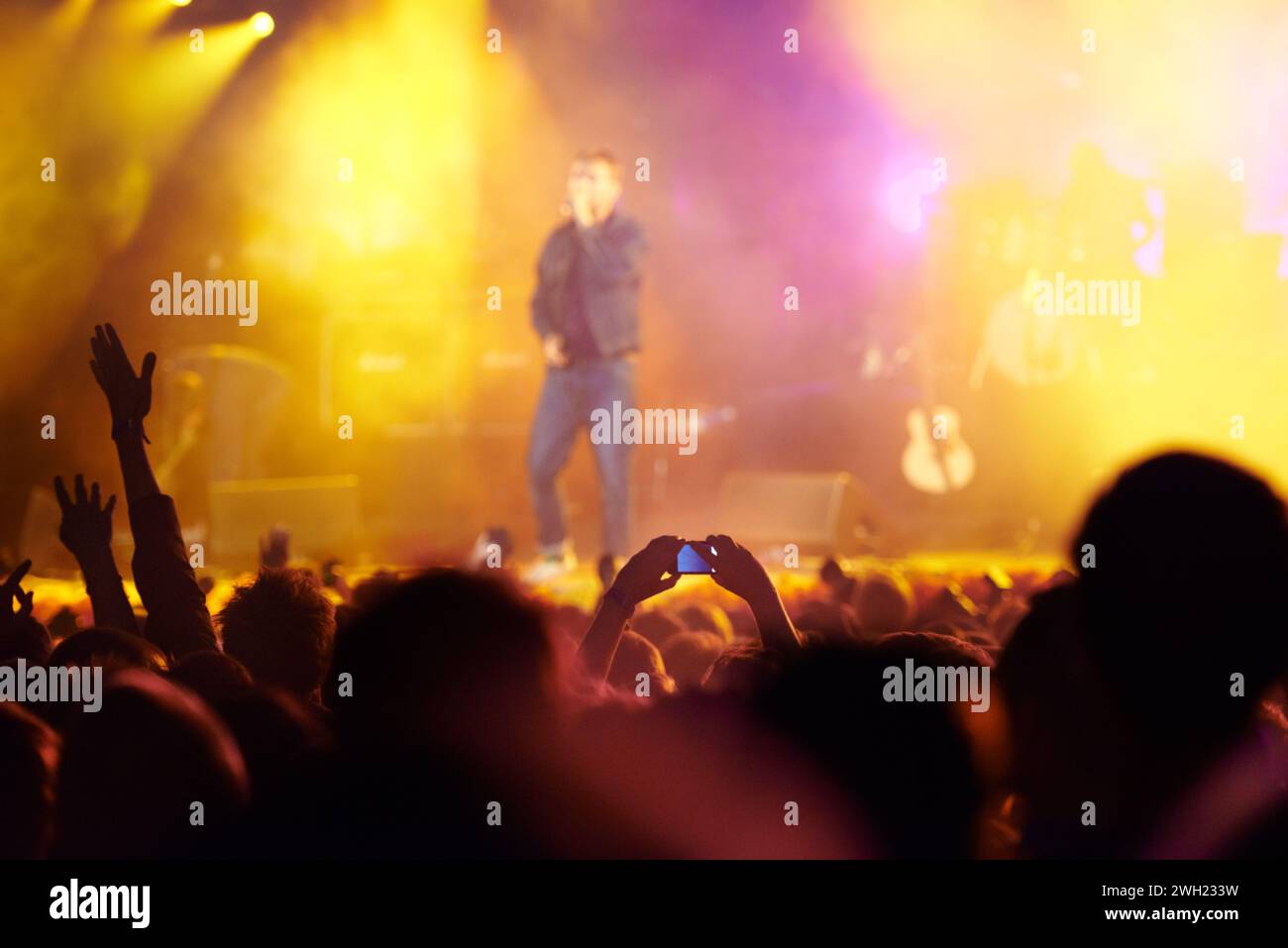 Music festival, audience and hands in crowd with band for concert ...