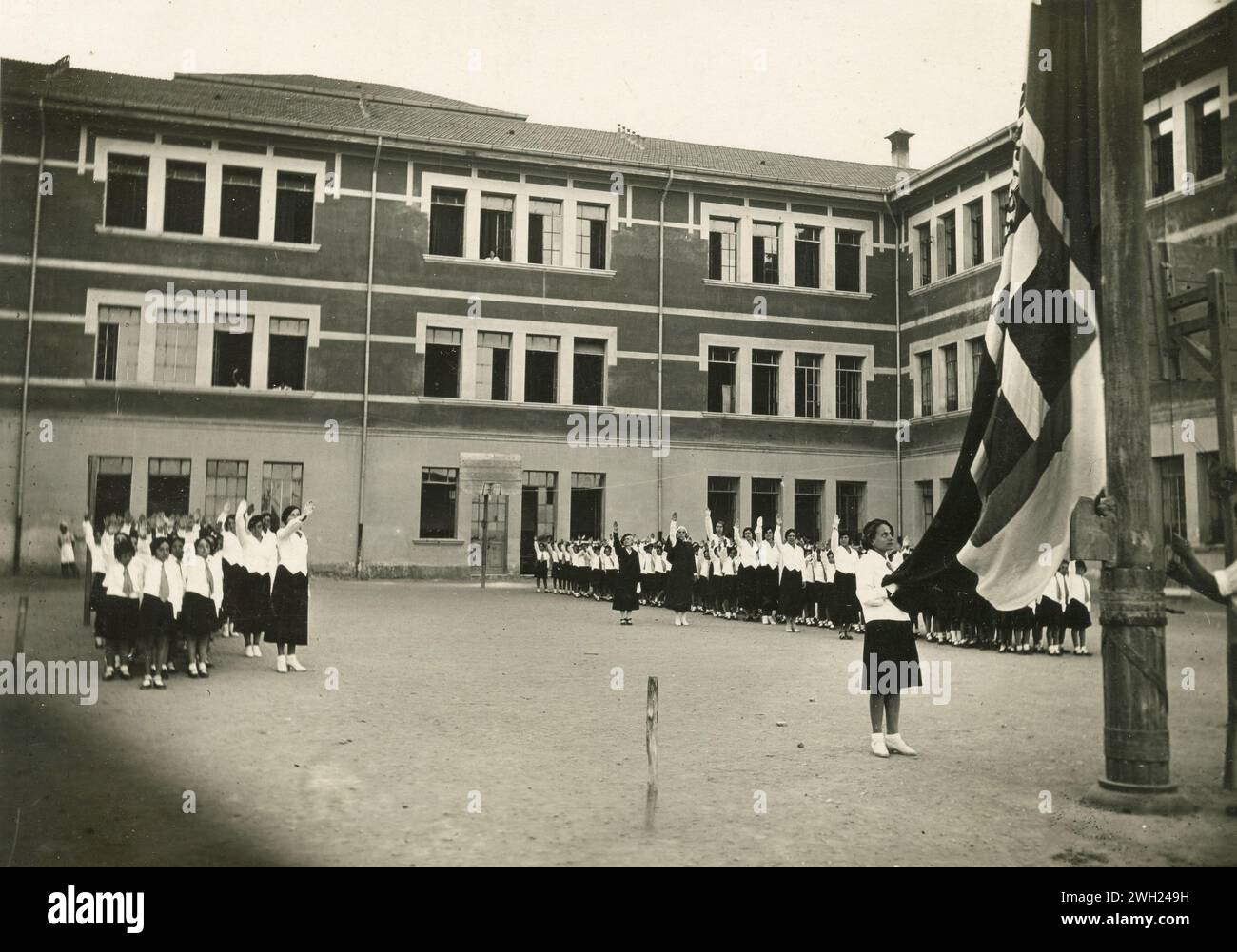 Girls of the fascist school gathered in the courtyard for the flag ...
